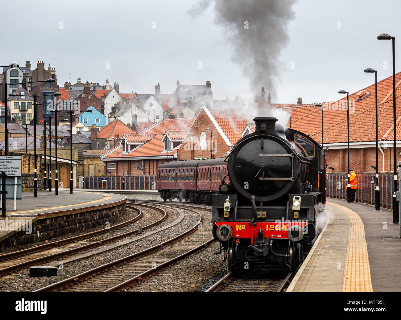 Steam locomotive LNER 1264 pulling out of Whitby station with full head ...