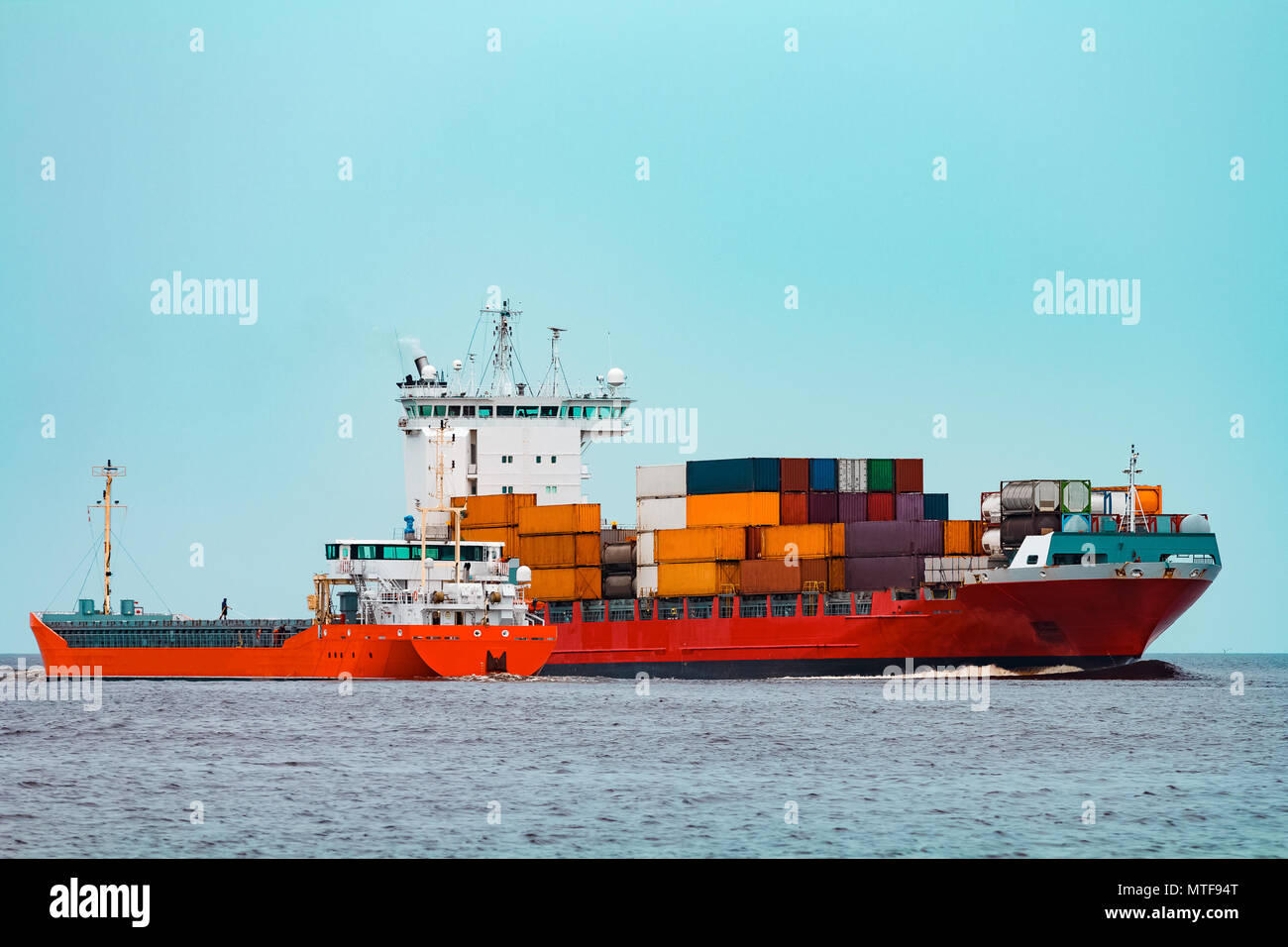 Red container ship. Logistics and production export Stock Photo - Alamy