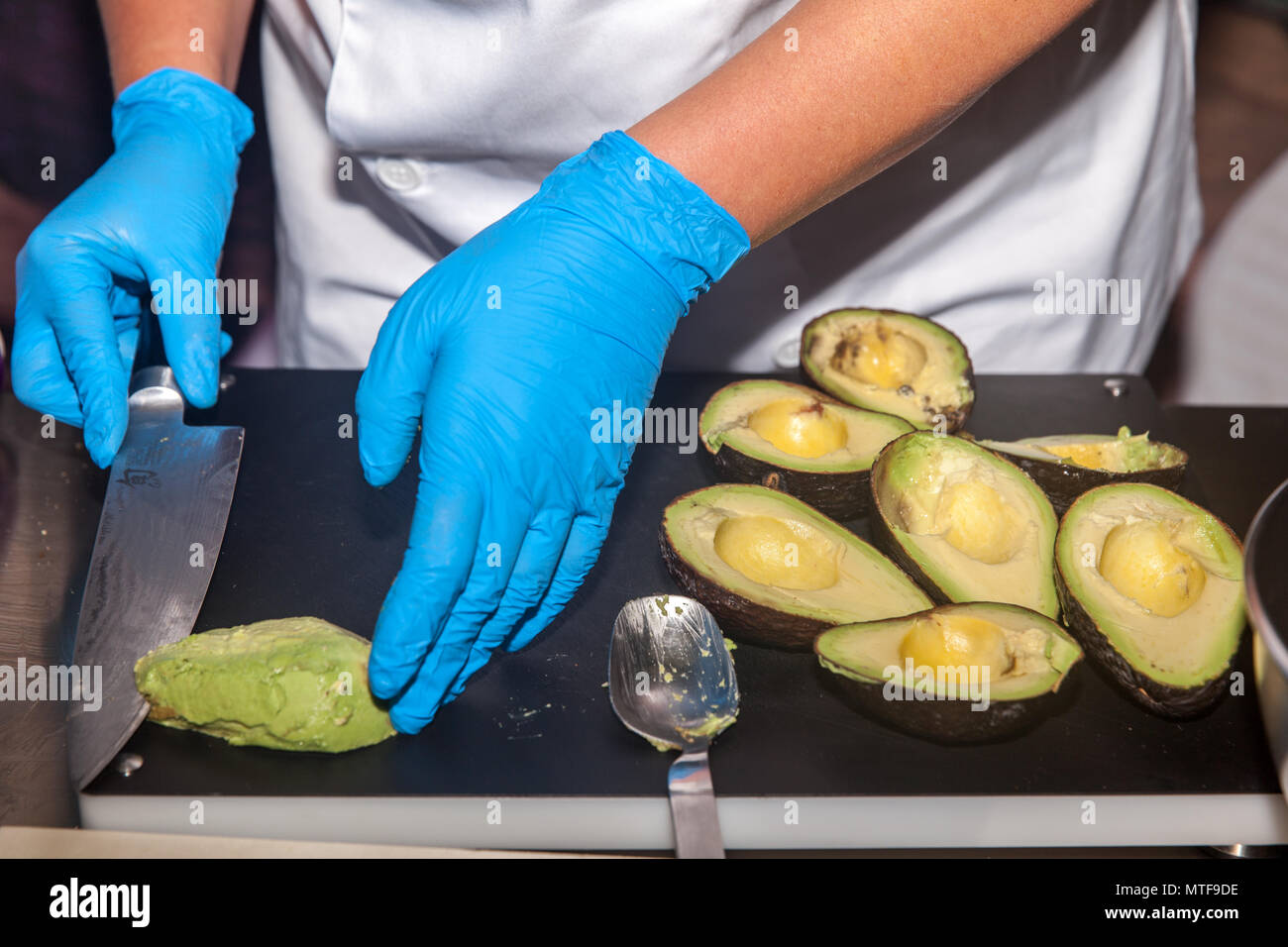spanish cook cutting avocadoes Stock Photo - Alamy