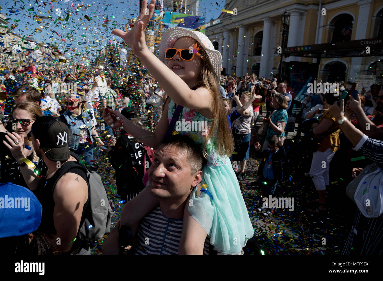 People rejoice at the confetti-salute on Nevsky Prospekt during the ...