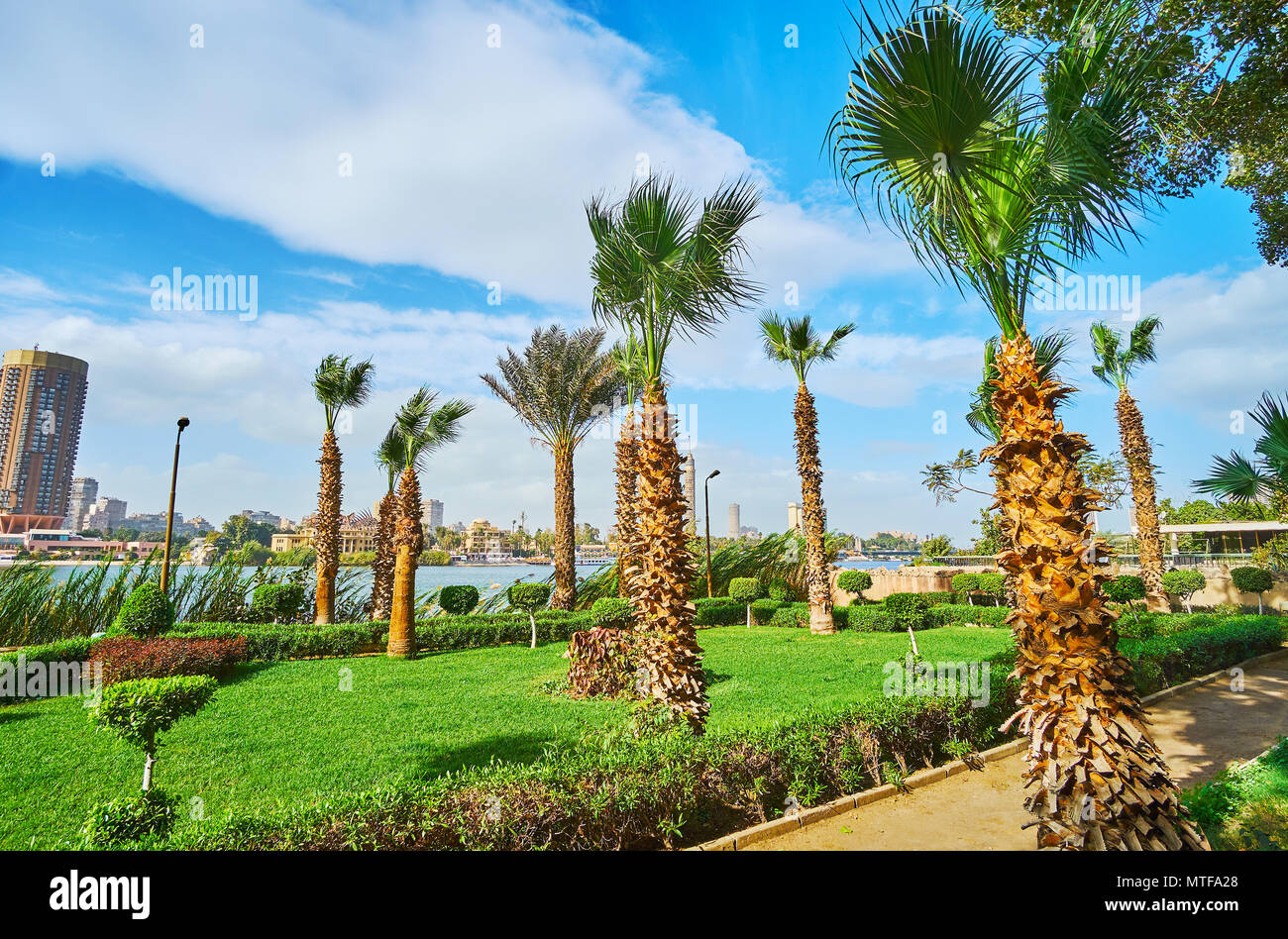 The pleasant walk along the footpath of riverside ornamental garden ...
