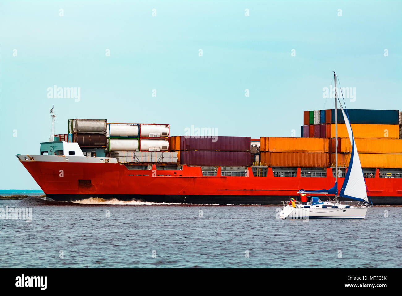 Red container ship. Logistics and production export Stock Photo - Alamy