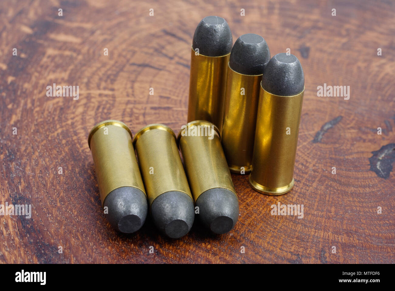 Revolver cartridges .45 Cal Wild West period on wooden background Stock ...