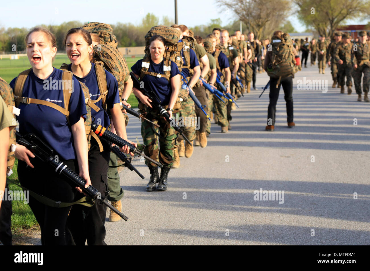 Marine Corps officer candidates participate in a four-mile hike during ...