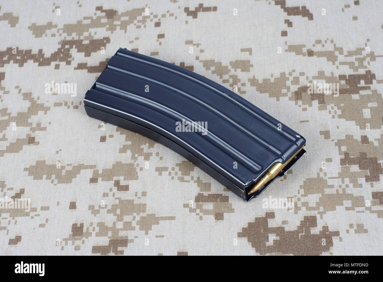 US MARINES M-16 rifle magazine with cartridges on camouflage uniform ...