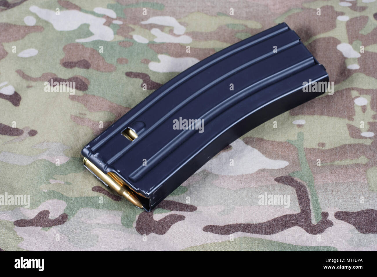 US ARMY M-16 rifle magazine with cartridges on camouflage uniform ...