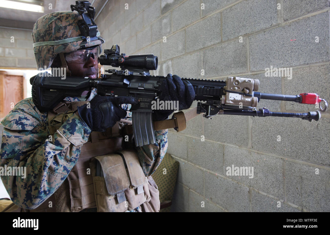 A Marine covers his sector of fire during a military operation on ...