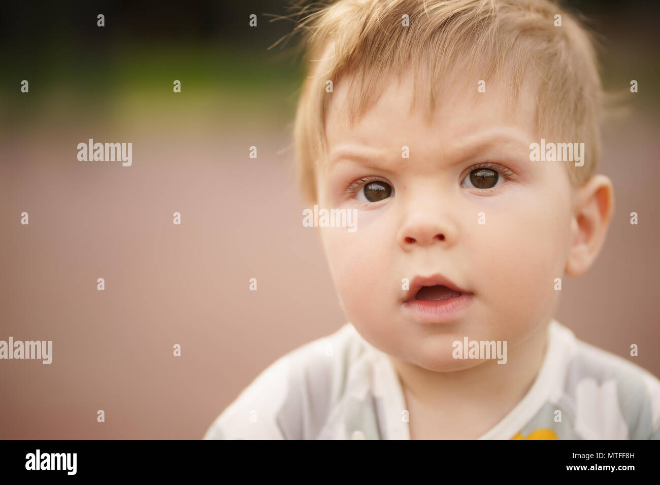 Playing boy face expression hi-res stock photography and images - Alamy