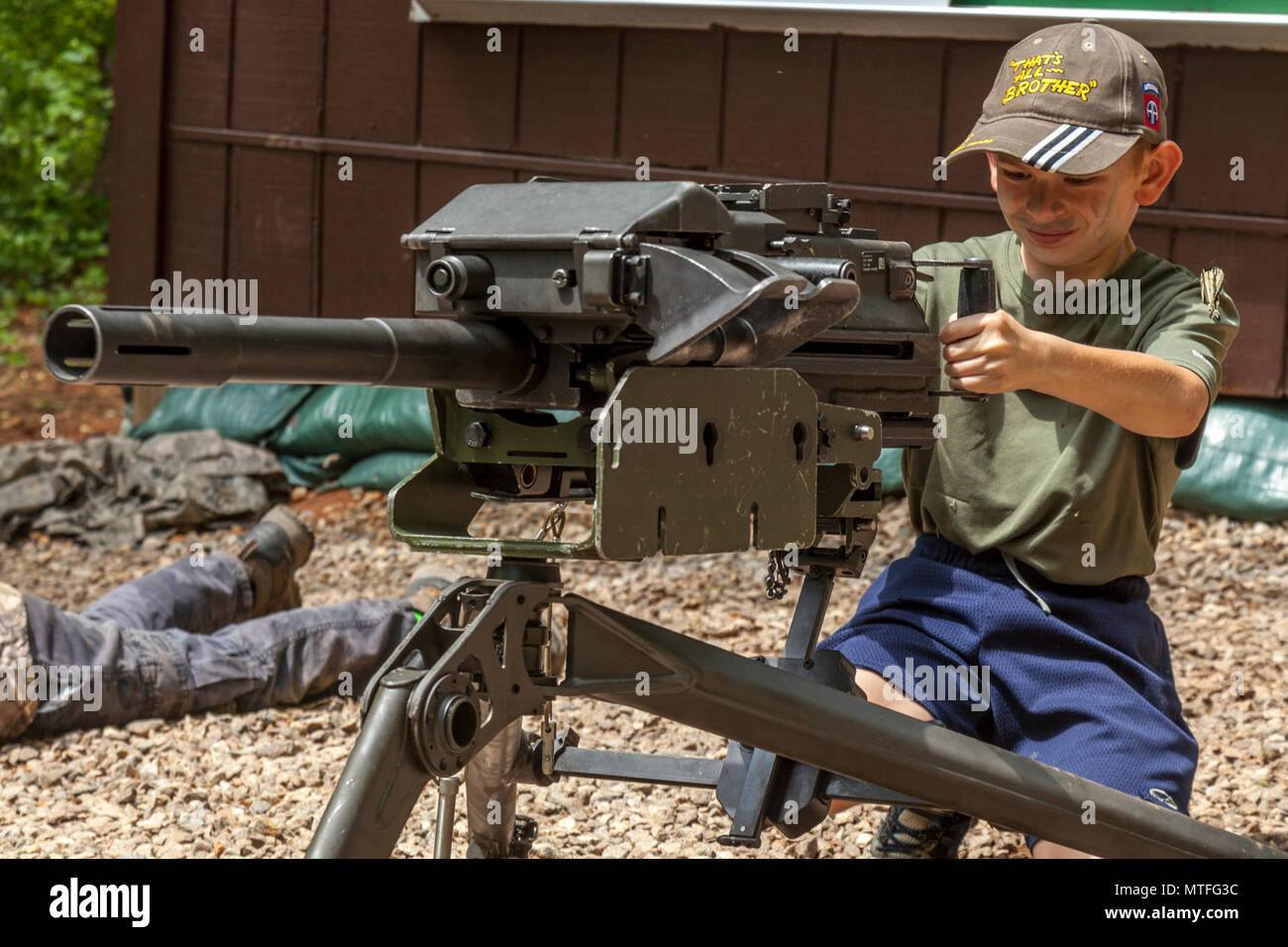 A guest examines a MK-19 40mm grenade launcher during the 5th RTB Open ...