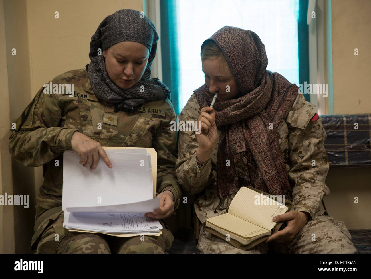 A U.S. Army soldier with Task Force Forge, left, and a U.S. Sailor with ...