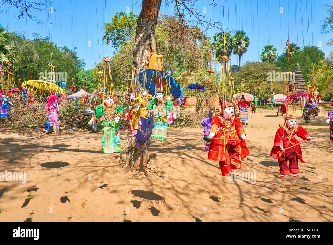 Traditional handmade string puppets in colored dresses and bright ...