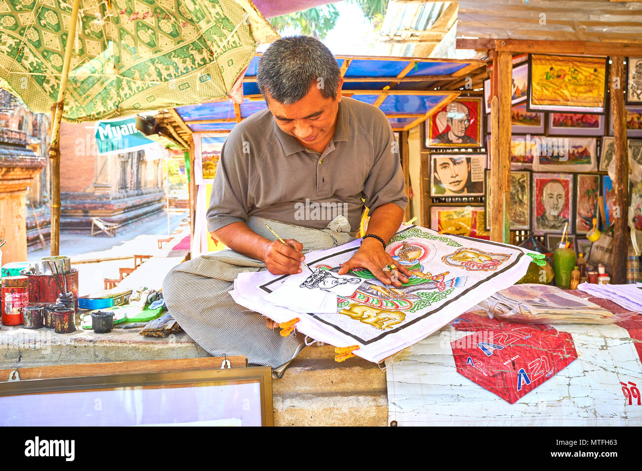 BAGAN, MYANMAR - FEBRUARY 24, 2018: The old artist paint the elephant ...