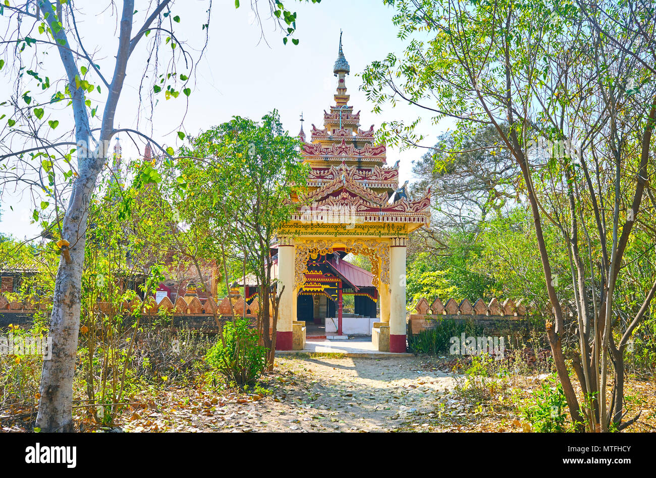 The beautiful entrance arch to the small temple is decorated with ...