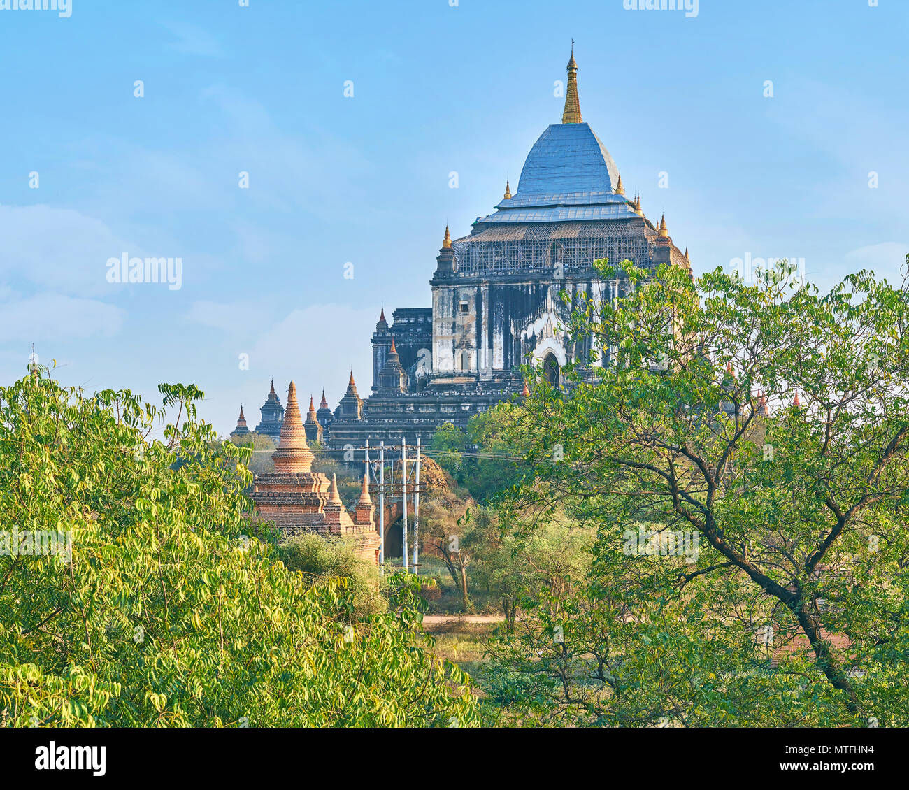 The monumental Thatbyinnyu Temple dominates over surrounding landscape ...