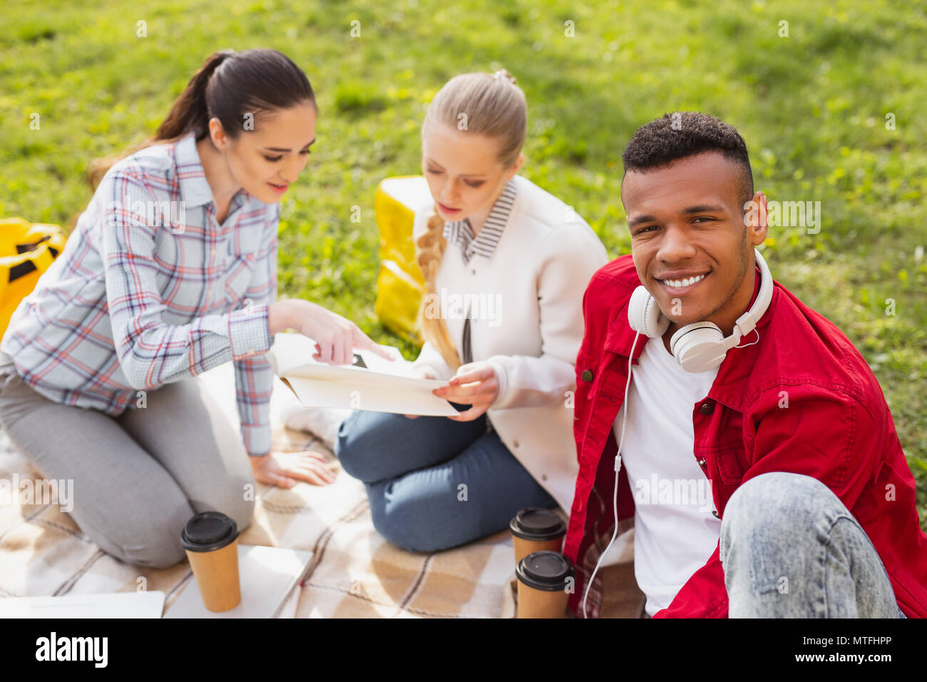 Young fellow feeling amazing while cooperating with his groupmates ...