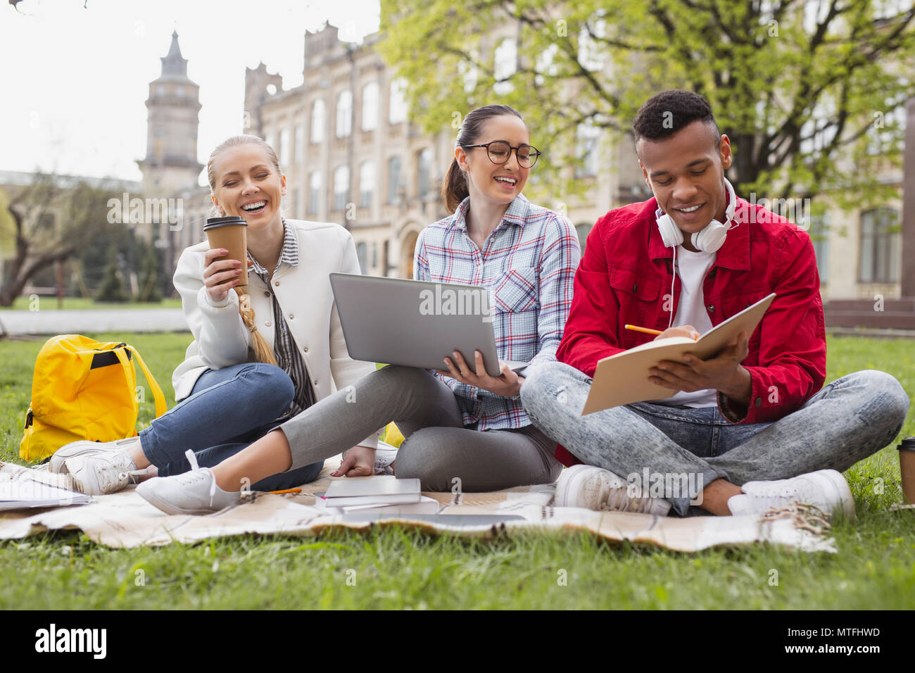 Hard-working students feeling amazing drinking coffee in the park Stock ...