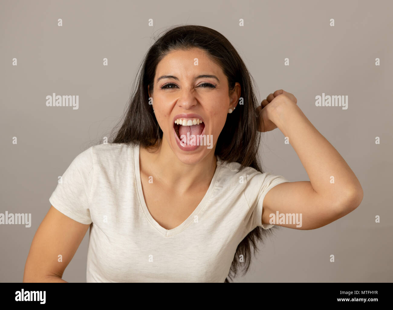Young beautiful happy euphoric and excited latin woman celebrating ...