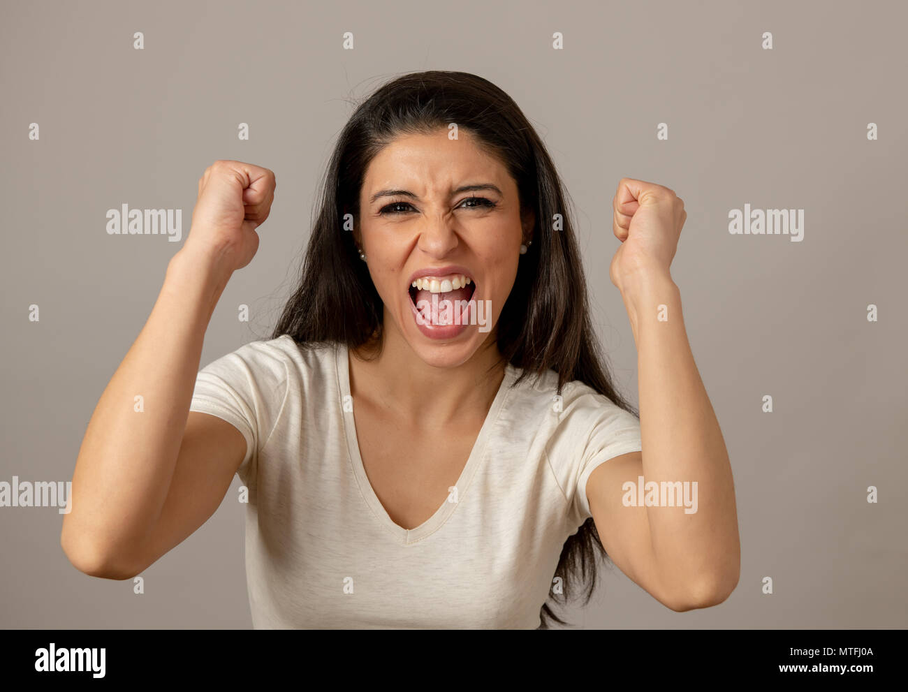 Young beautiful latin happy euphoric and excited woman celebrating ...