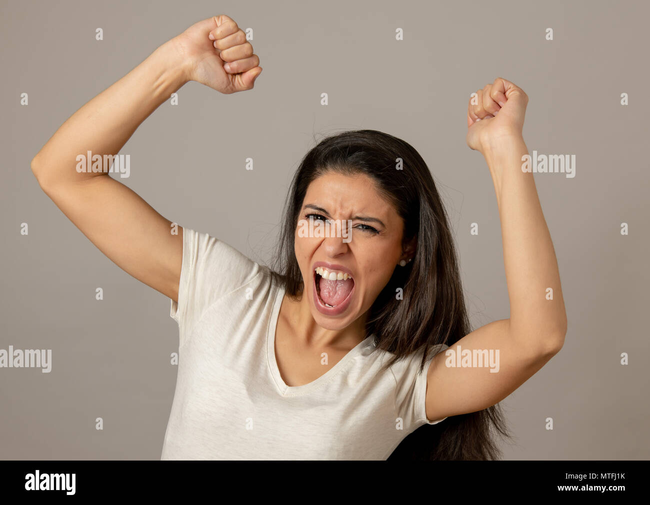 Young beautiful latin happy euphoric and excited woman celebrating ...