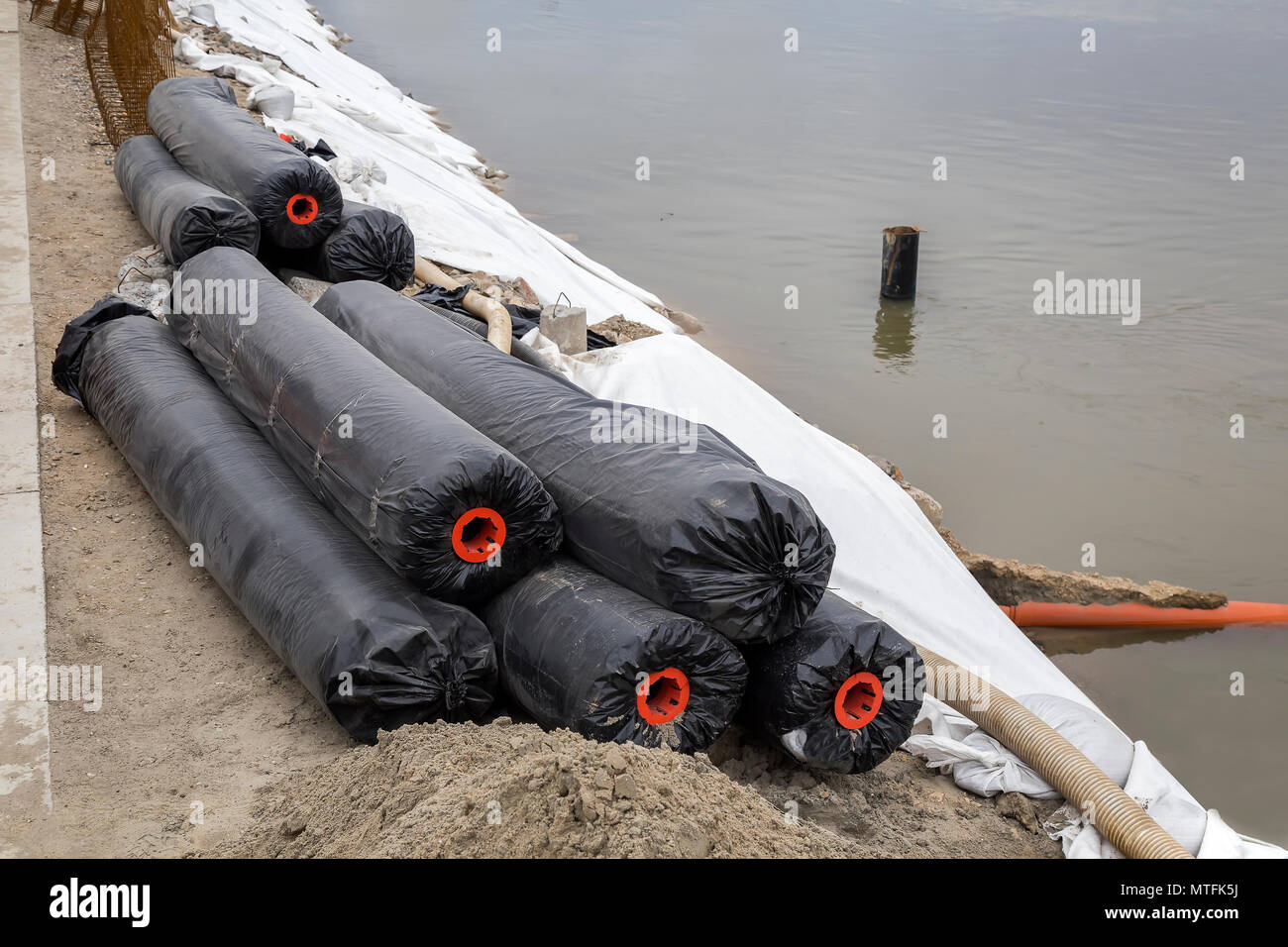 Geotextile tubes for river bank protection. Protects the bank and the ...