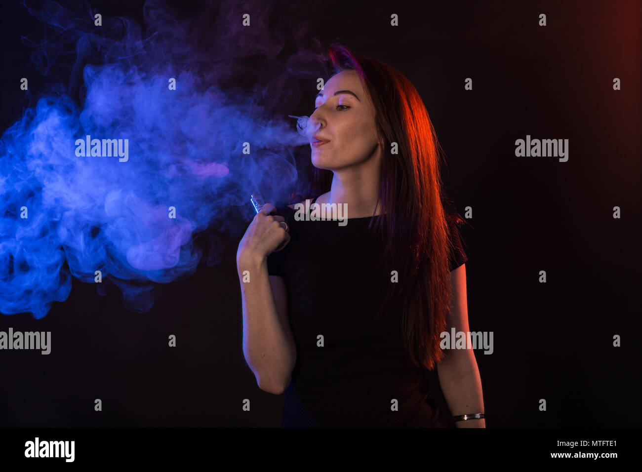 Pretty woman cigarette in hand hi-res stock photography and images - Alamy