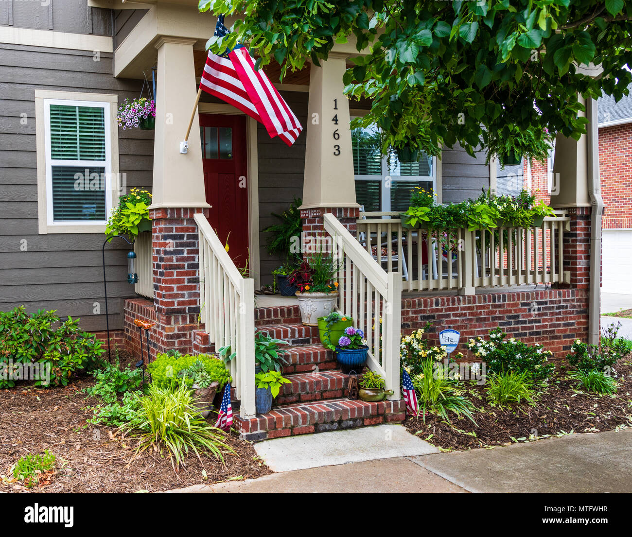 American flag front of house hi-res stock photography and images - Alamy
