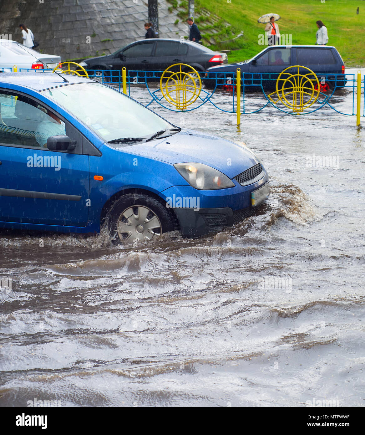 Road flooded by water in a rain. Traffic problem Stock Photo - Alamy