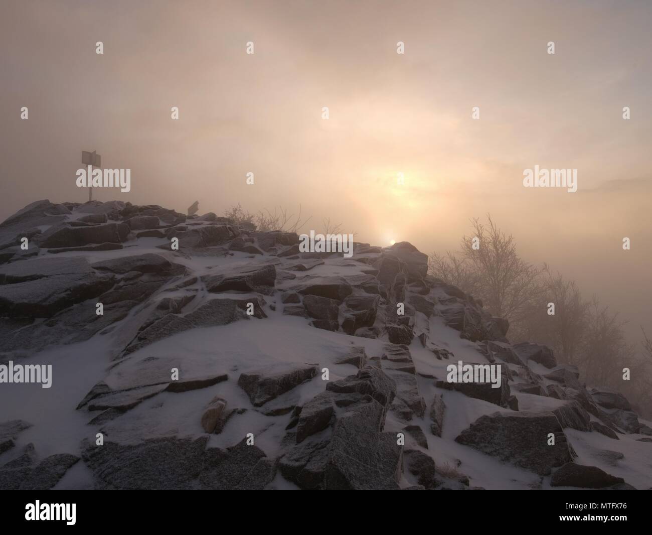 Mountain snowy peak hidden in heavy mist. Extreme weather. Dramatic ...