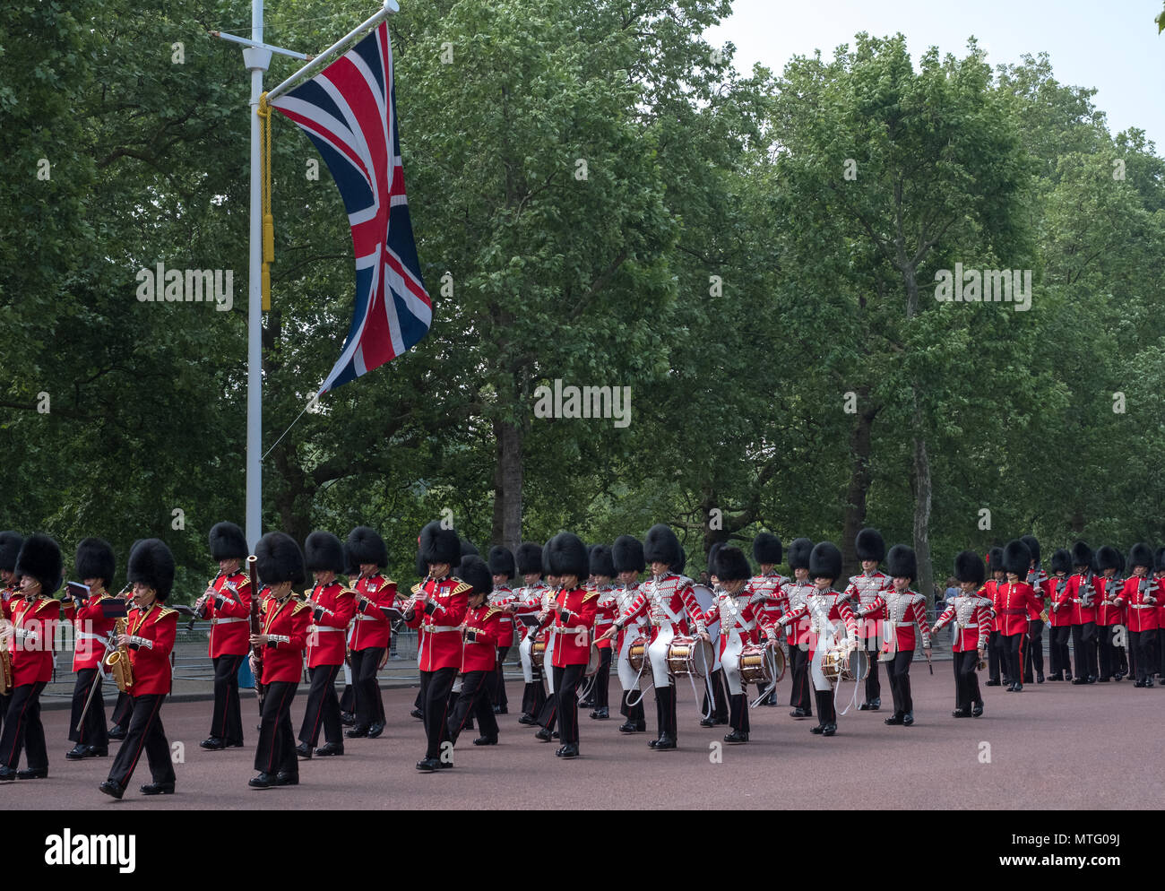 London UK. Military band marches down the The Mall outside Buckingham ...