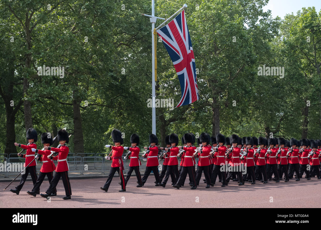 Soldiers with rifles marching down The Mall in London. Photo taken ...