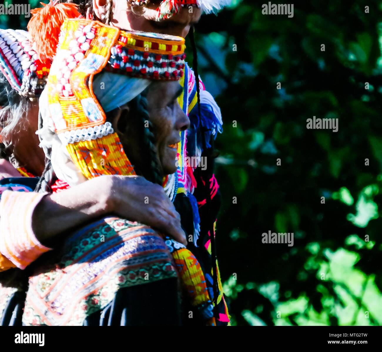 Portrait of Kalash tribe woman in national costume at Joshi fest - 14 ...