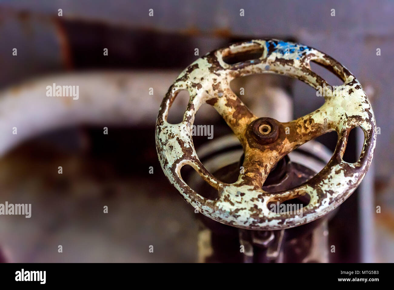 Rusty industrial valve close Stock Photo - Alamy