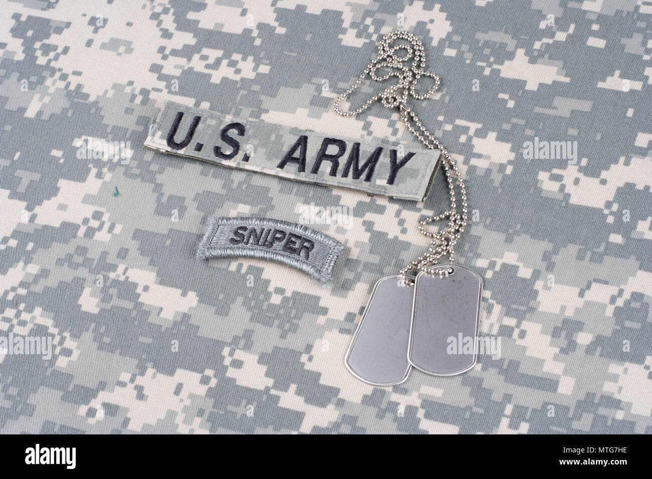 KIEV, UKRAINE - August 21, 2015. US ARMY sniper tab with dog tags on ...
