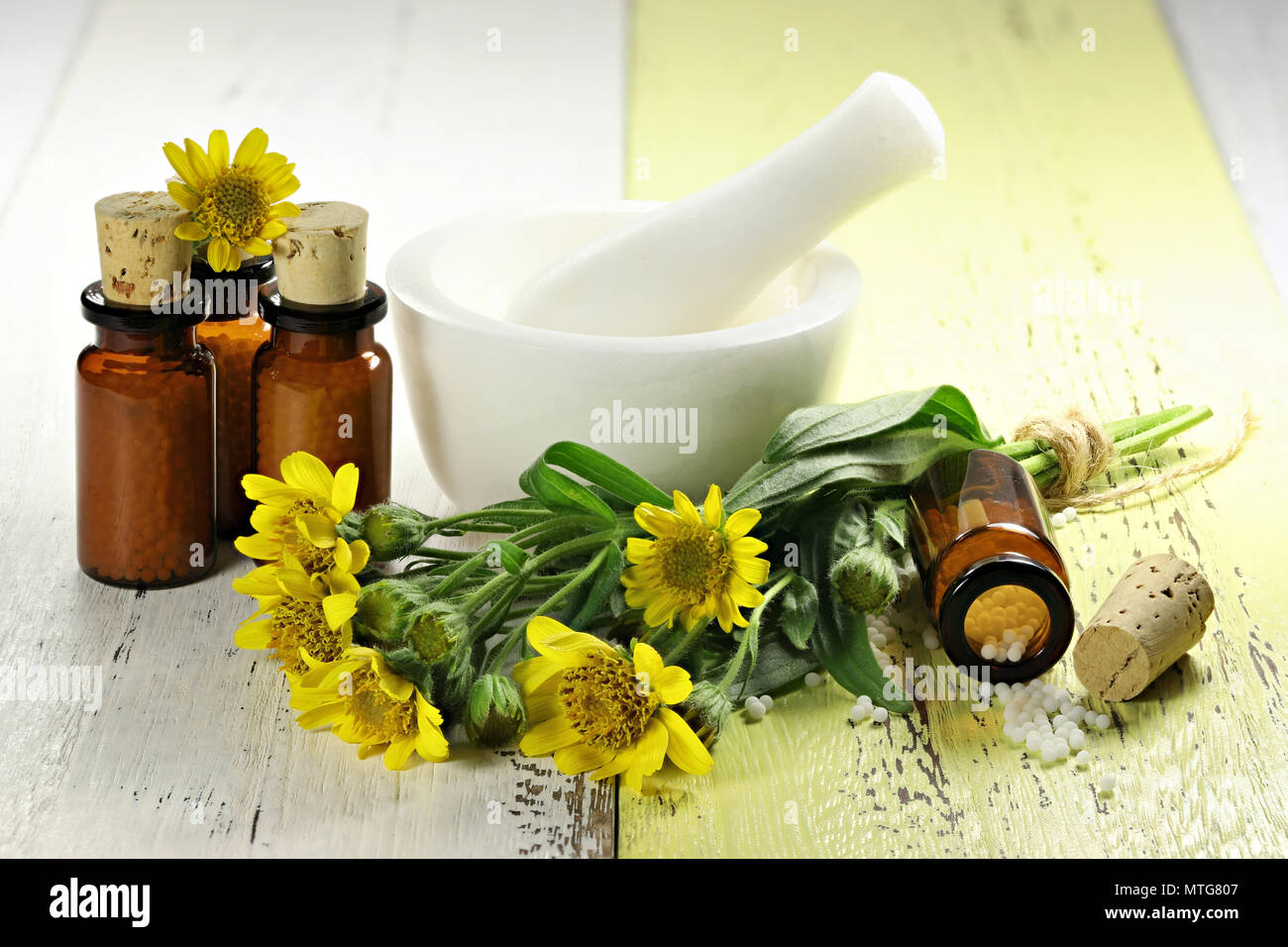 homeopathic arnica pills in brown bottles on wooden background Stock ...