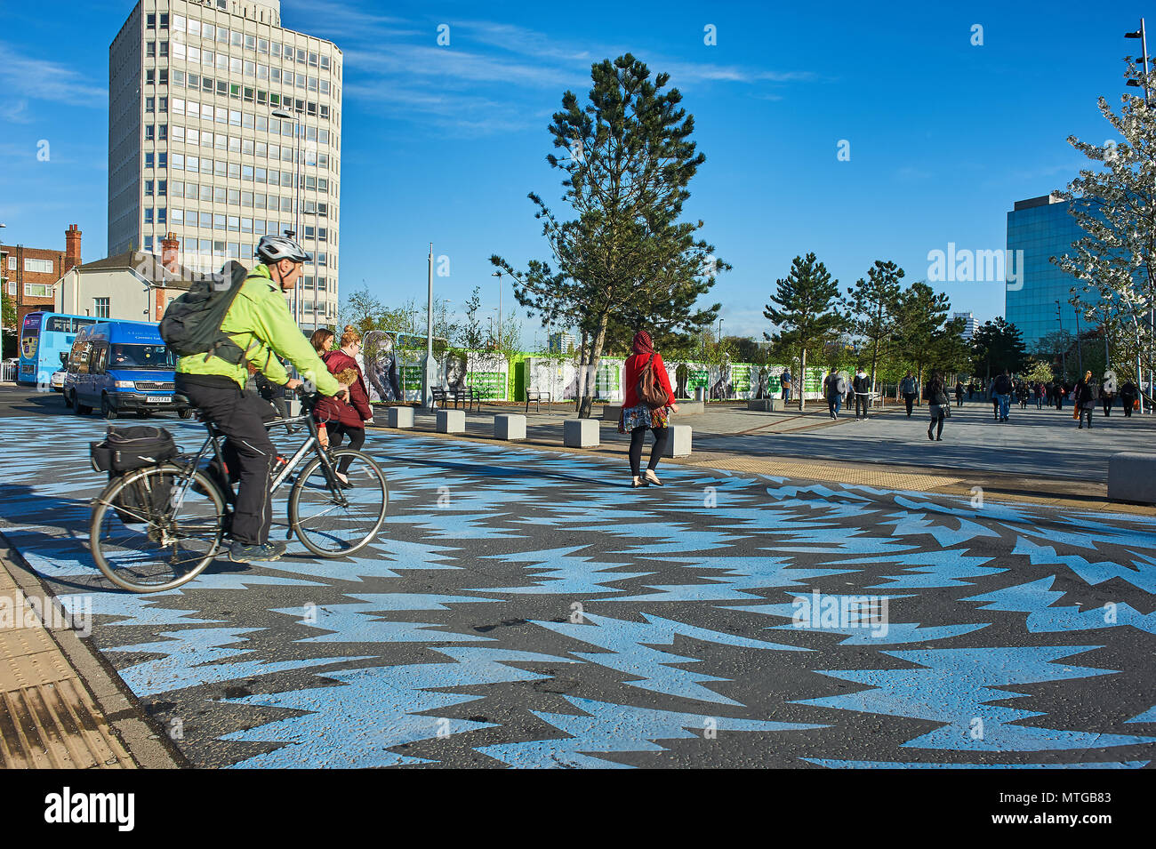 Commuters cycling to work on an urban street Stock Photo - Alamy