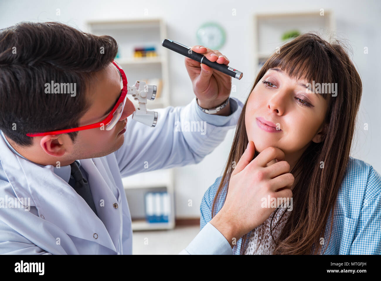 Doctor examining patients eye in hospital Stock Photo - Alamy