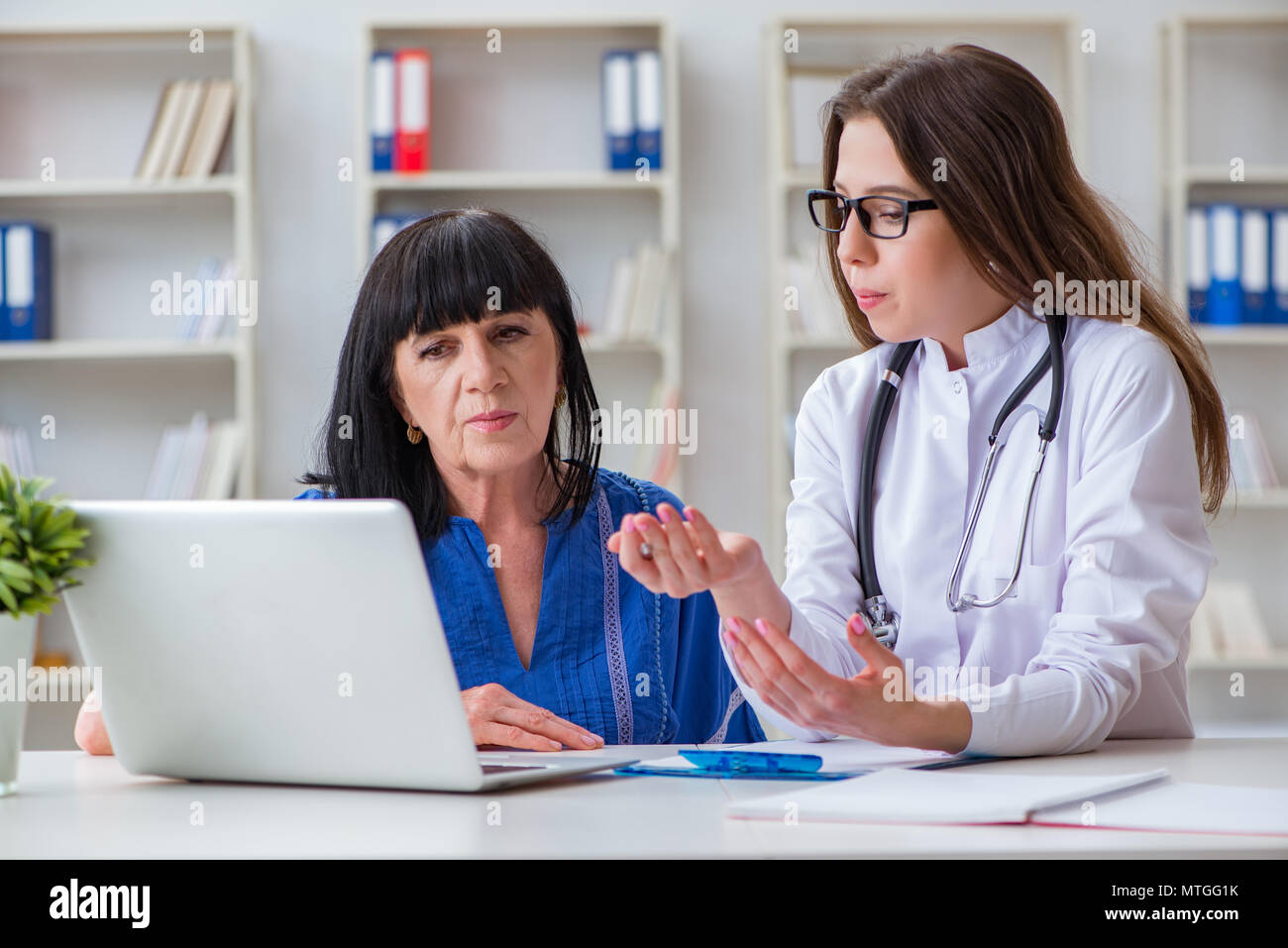 Senior patient visiting doctor for regular check-up Stock Photo - Alamy