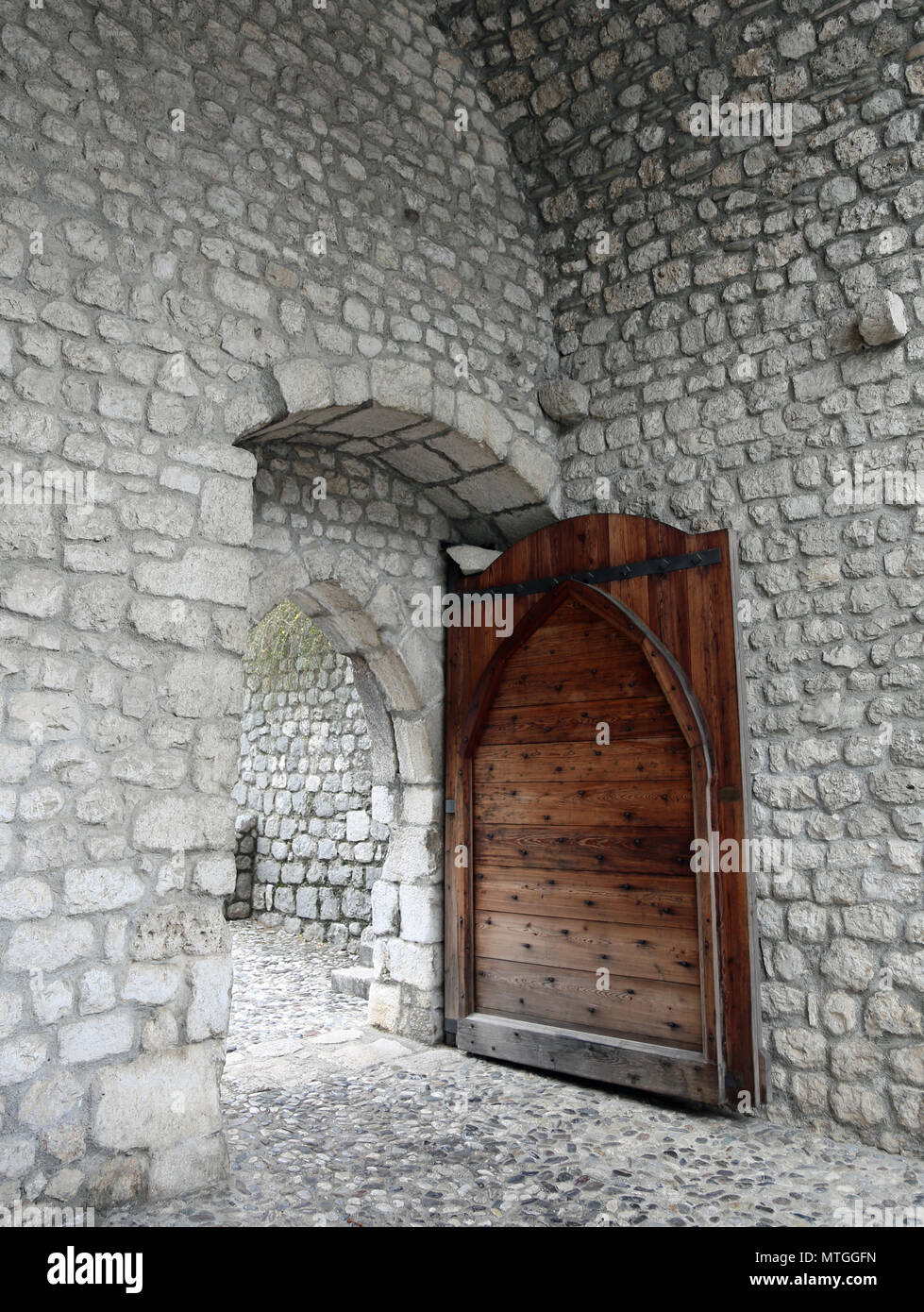 old medieval solid wood door open at the entrance to a village Stock ...