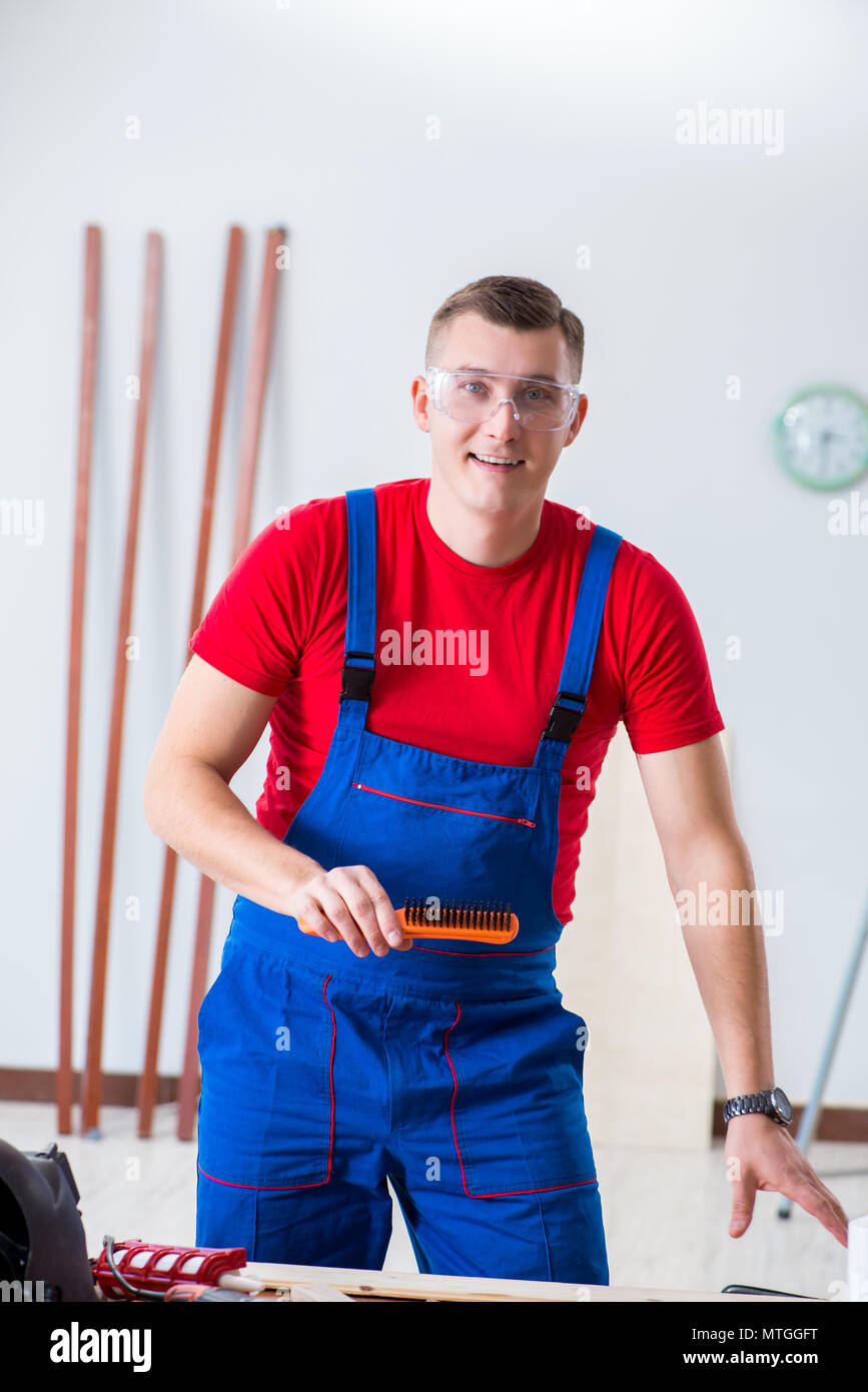 Contractor working in the workshop Stock Photo - Alamy