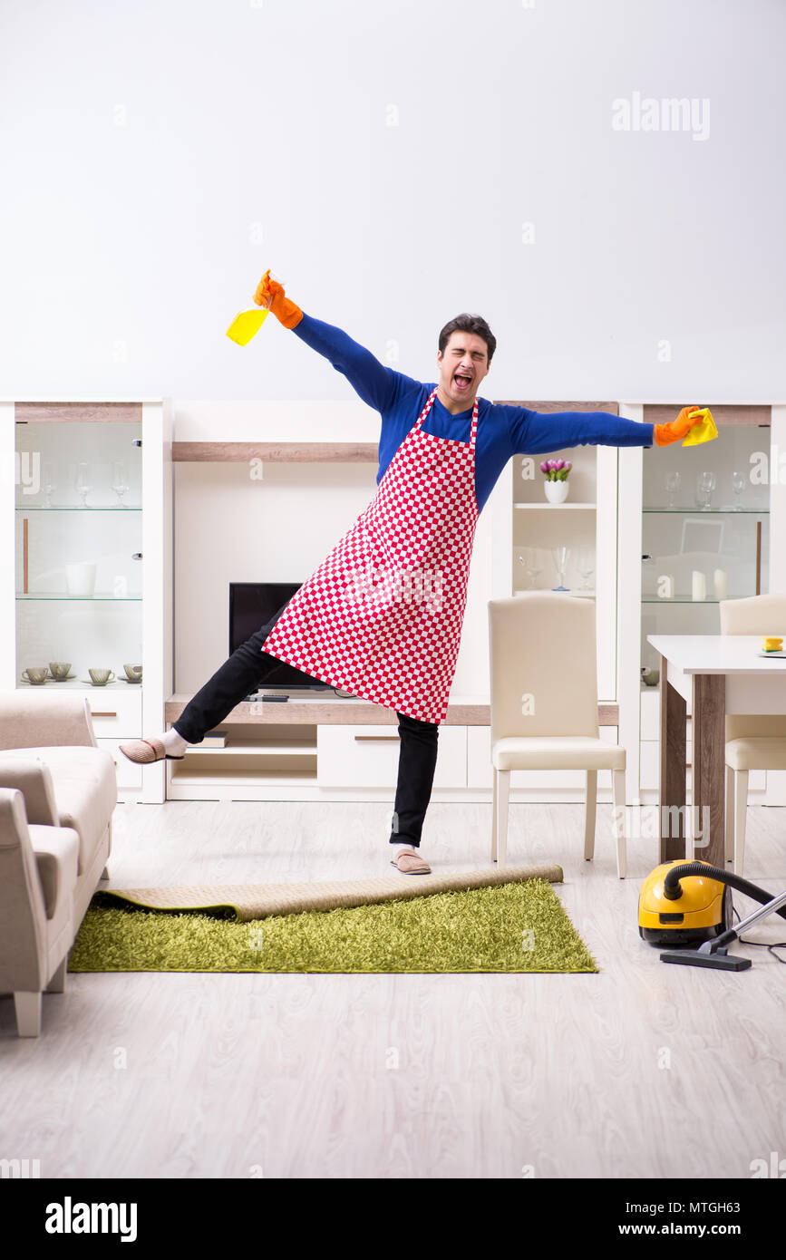 Contractor man cleaning house doing chores Stock Photo - Alamy