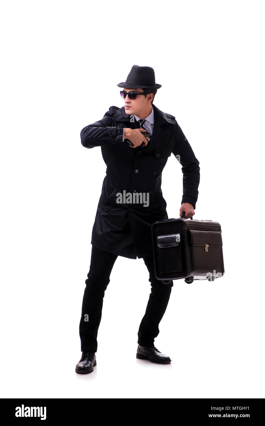 Man spy with handgun isolated on white background Stock Photo - Alamy
