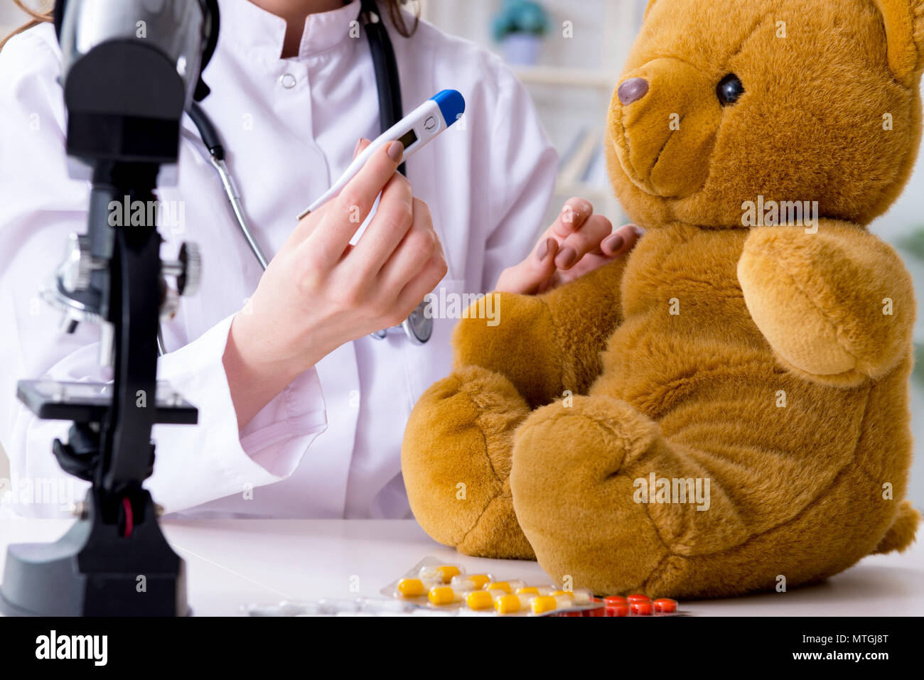 Child checking soft toy health Stock Photo - Alamy