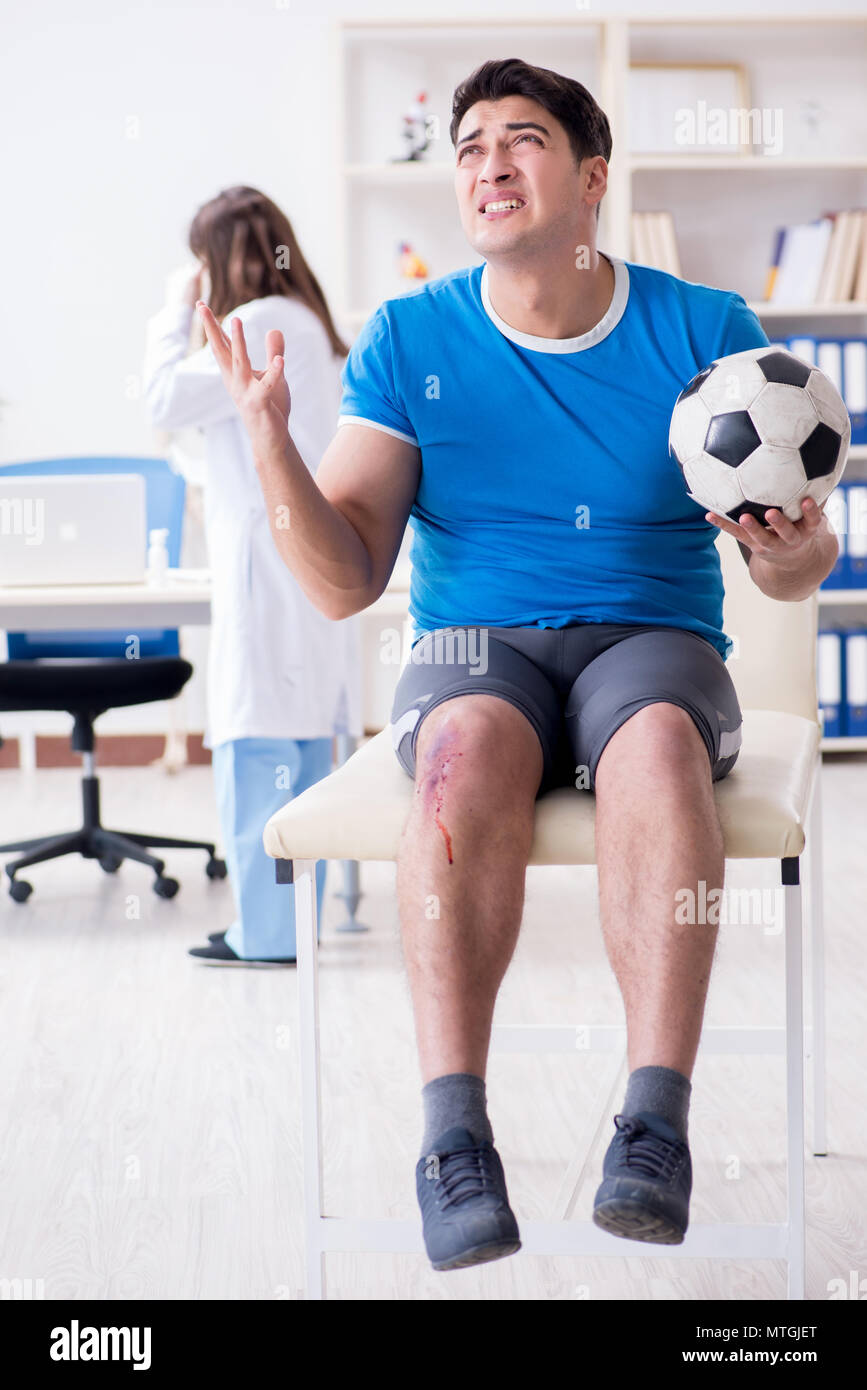Football soccer player visiting doctor after injury Stock Photo - Alamy