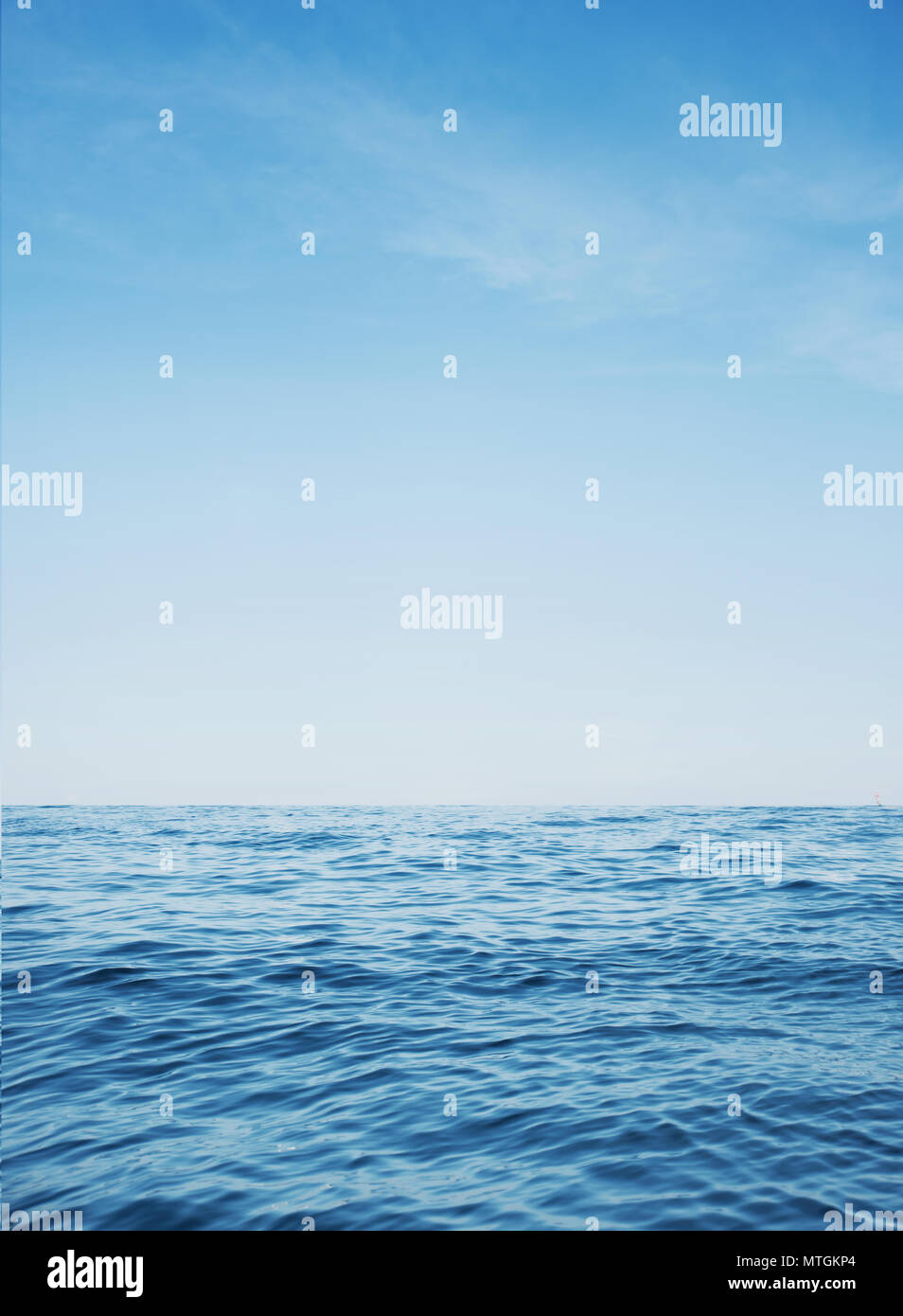 Calm ocean with clear blue water Stock Photo - Alamy