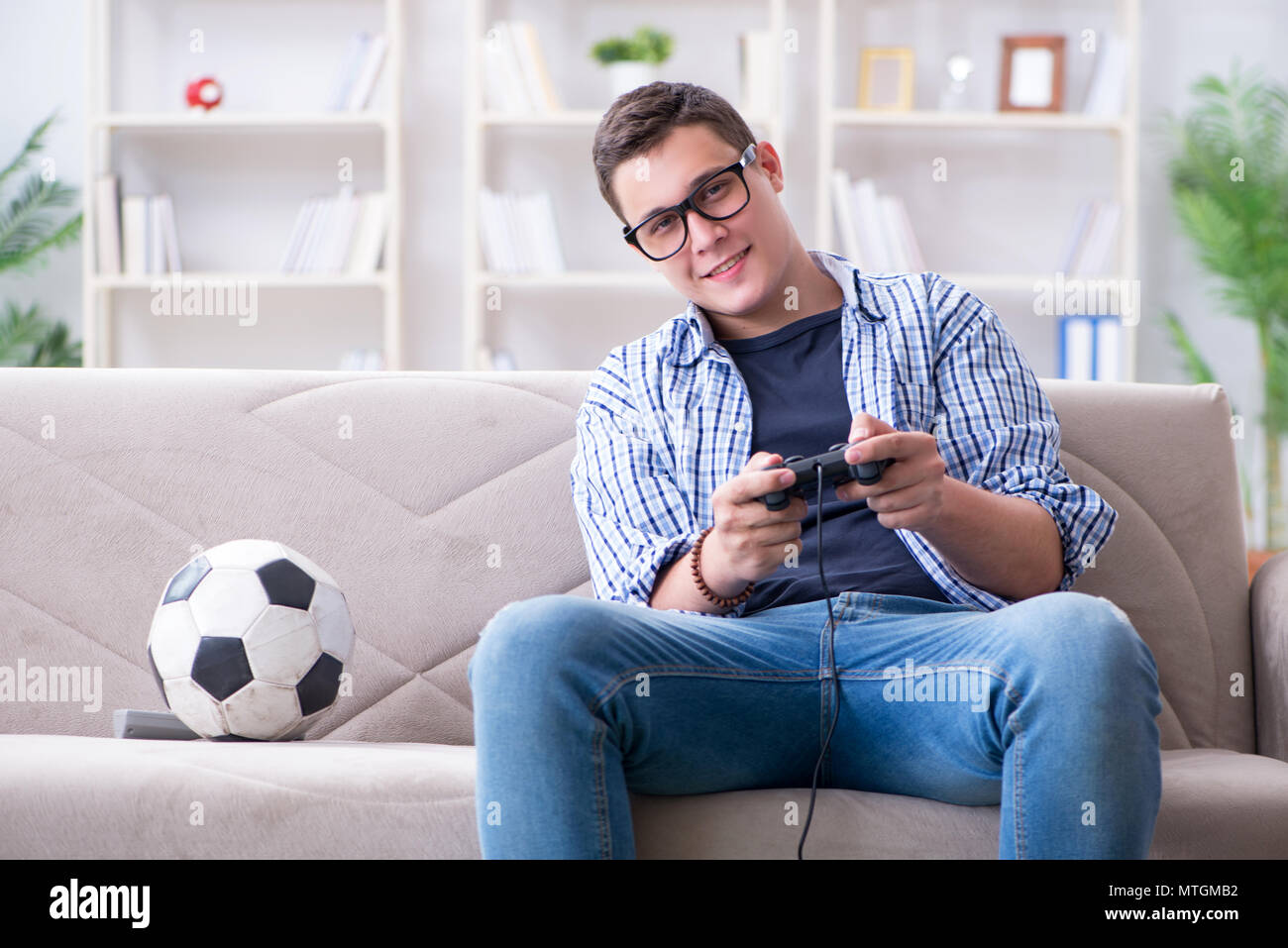 Addicted excited young man playing hi-res stock photography and images ...
