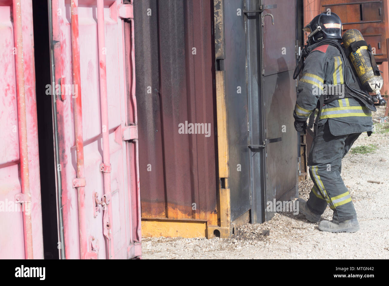 Firefighter putting out fire training station extinguisher backdraft ...
