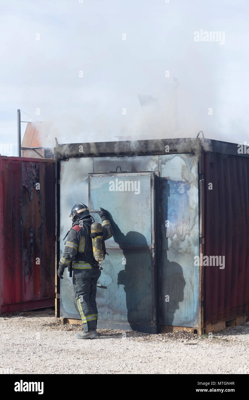 Firefighter putting out fire training station extinguisher backdraft ...