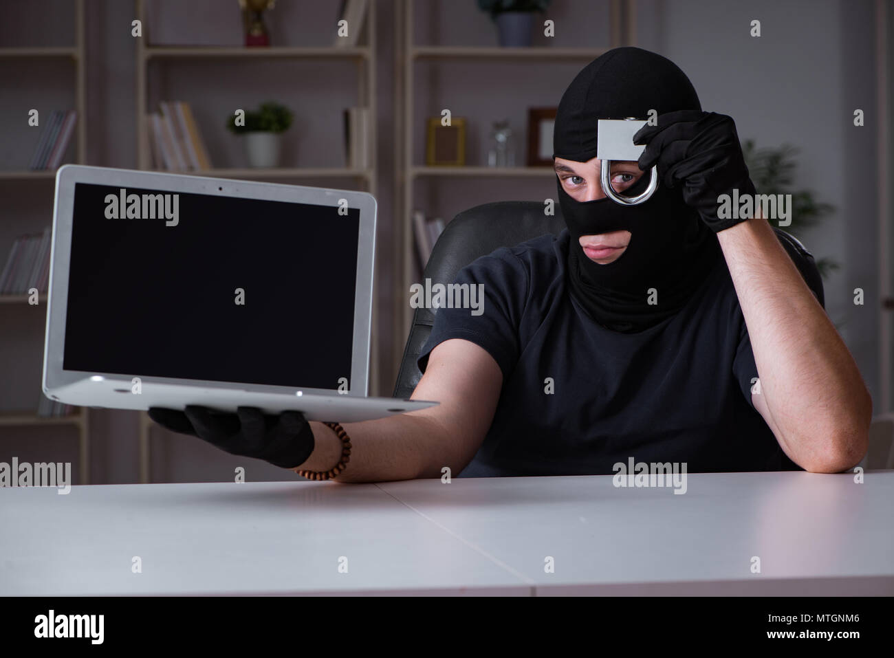 Hacker hacking computer late at night Stock Photo - Alamy