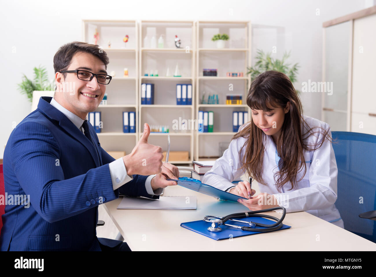 Thumbs up contract employment hi-res stock photography and images - Alamy