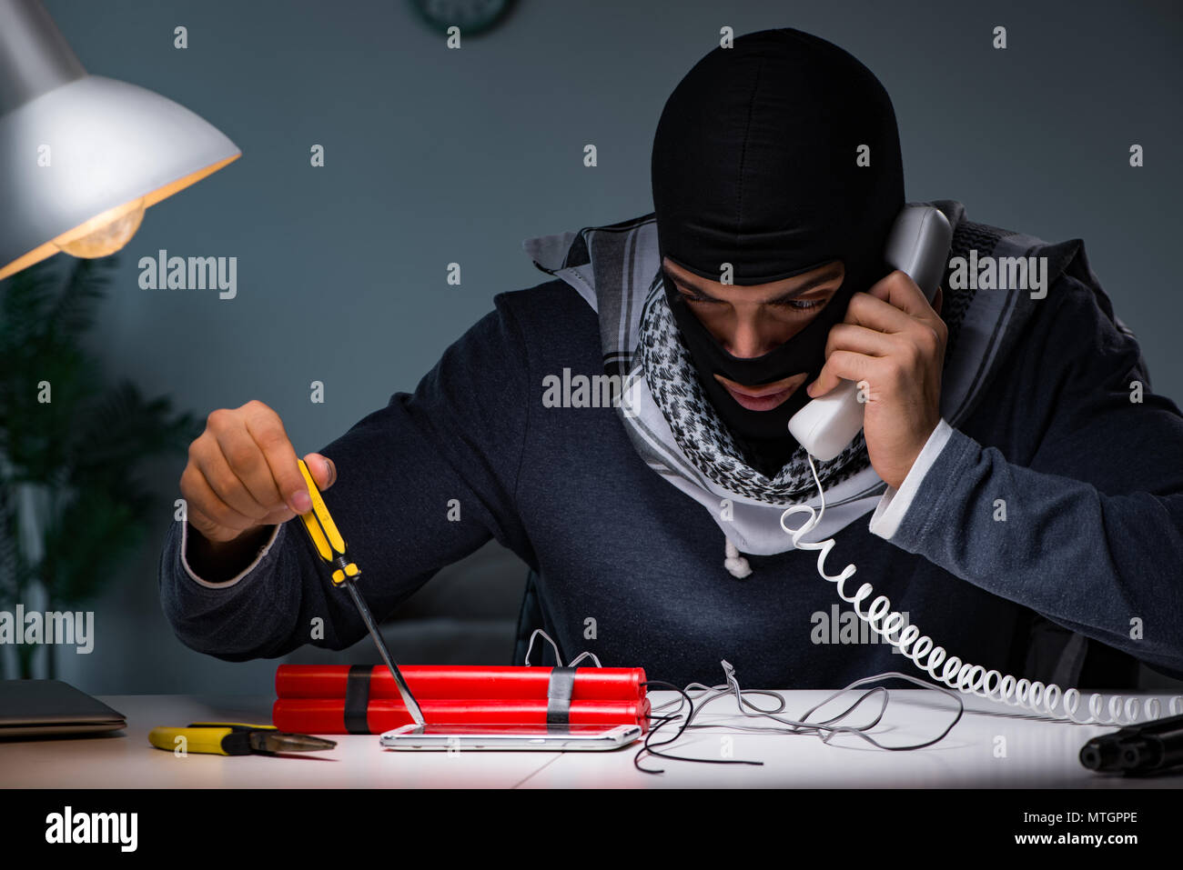 Terrorist bomber preparing dynamite bomb Stock Photo - Alamy